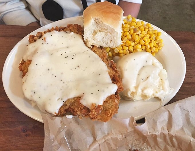 Chicken fried steak smothered in gravy so good you'll want to write poetry about it. Paired with mashed potatoes and corn, it's comfort on a plate.