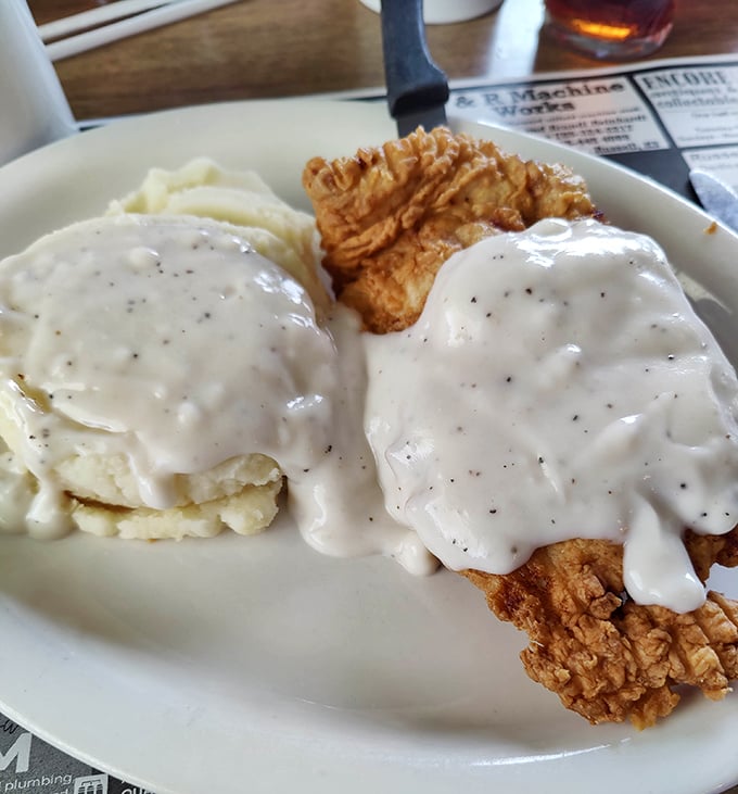 Chicken fried steak swimming in peppery gravy—a dish so quintessentially Midwestern it practically comes with its own accent.