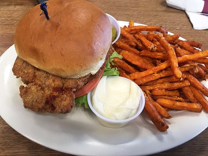 Not just any chicken sandwich—this is what happens when comfort food gets dressed up for a night out, with sweet potato fries as its glamorous date.