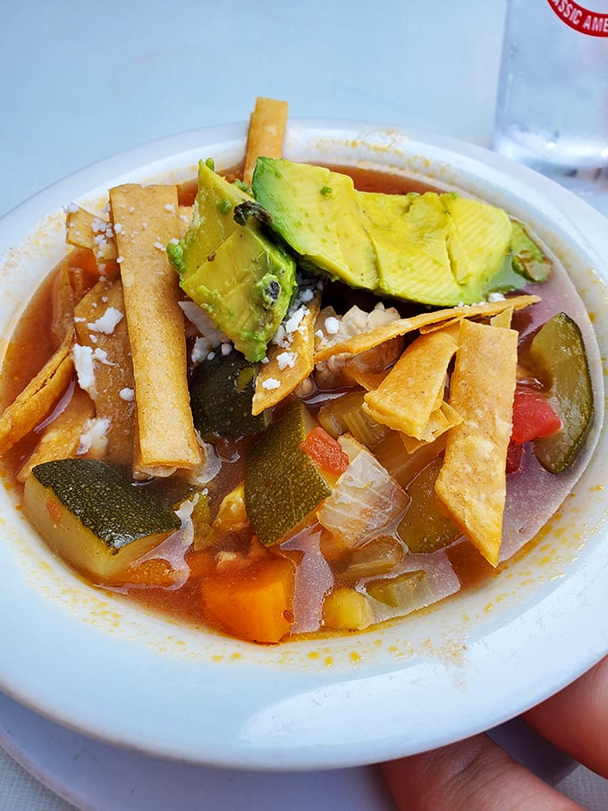 Tortilla soup that puts the "comfort" in comfort food. Those crispy strips aren't just garnish—they're the exclamation points of deliciousness.
