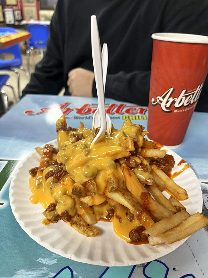 When chili and cheese meet crispy fries, magic happens – this towering masterpiece proves that some things are better when they're wonderfully excessive.