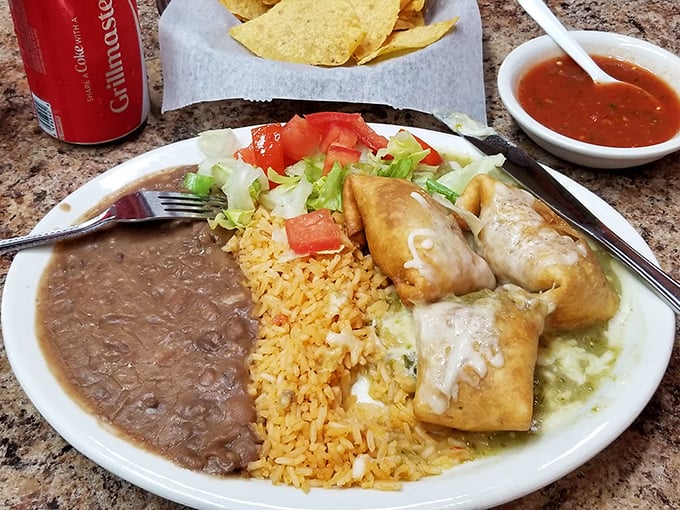 The chimichanga – that magical moment when a burrito takes a spa day in hot oil. Crispy exterior, tender filling, and that green sauce is practically drinkable.