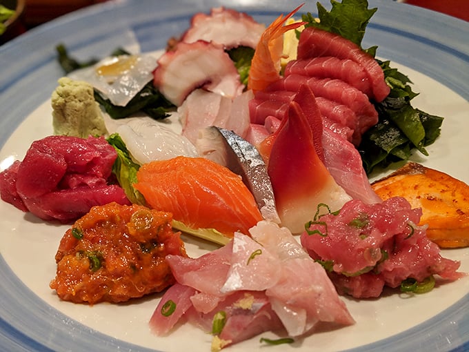 This sashimi platter isn't just food—it's an edible color wheel of ocean treasures, each slice promising its own distinct moment of pure joy.