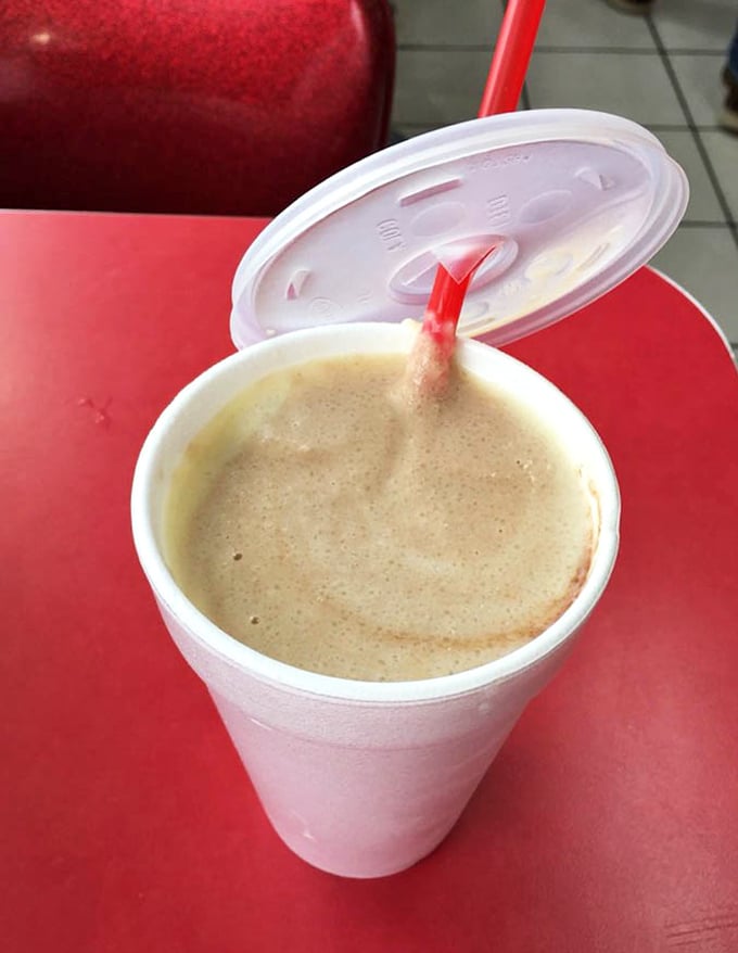 The chocolate shake arrives like a creamy ambassador from the land of dairy delights—thick enough for a spoon but still navigable by straw.