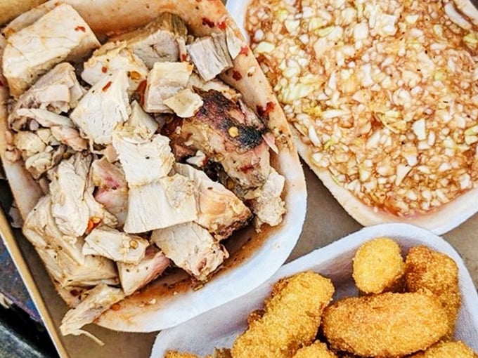 Chopped pork with that telltale pink smoke ring—the barbecue equivalent of finding the Hope Diamond. Each morsel carries decades of hickory-smoked wisdom.