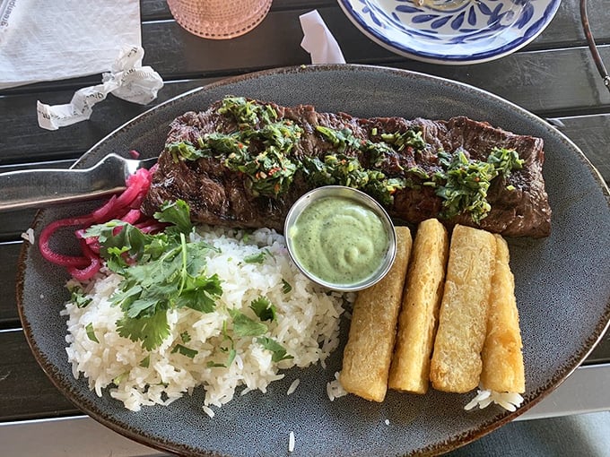 Perfectly grilled steak crowned with chimichurri, served alongside cilantro rice and golden plantains—proof that simplicity and quality make magic on a plate.