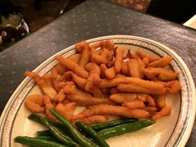 Golden-fried perfection with a side of vibrant green beans—comfort food that speaks the universal language of "you're going to need a nap after this."