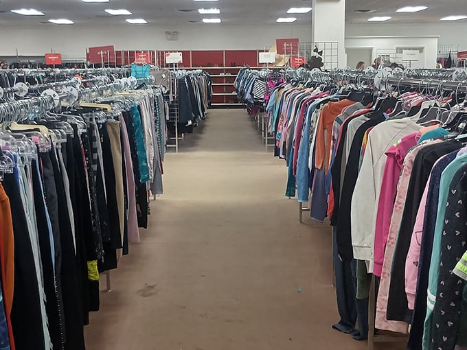The clothing aisles stretch like runways of possibility. Fashion democracy in action—where designer labels and everyday basics share the same affordable space.