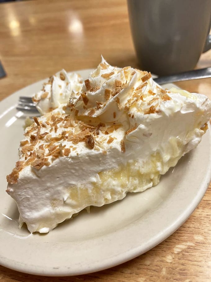 Coconut cream pie with toasted coconut flakes—architectural in height, cloud-like in texture. Resistance is futile.