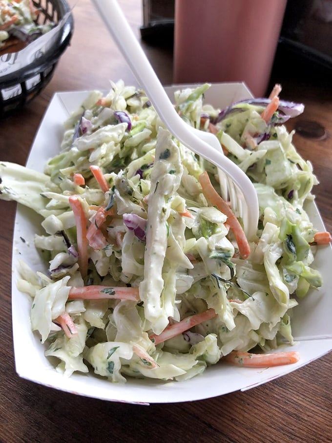Coleslaw that actually deserves respect. Crisp, fresh, and thoughtfully dressed—not the sad, soggy afterthought you've suffered through at lesser establishments.