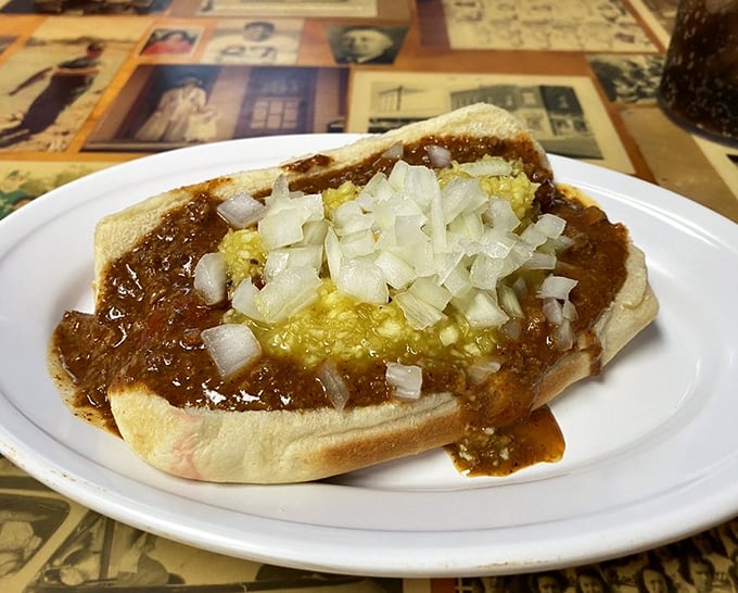 The coney dog – where chili, mustard, and onions come together like a delicious Americana power trio on a perfectly steamed bun.