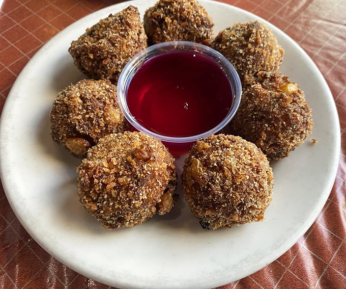 These corn fritters aren't just appetizers—they're little golden orbs of happiness that make waiting for your steak feel like a privilege rather than a chore.