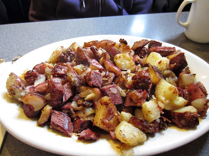 This isn't just corned beef hash – it's a masterclass in texture and flavor, where each crispy-edged potato cube has found its soulmate in tender corned beef.