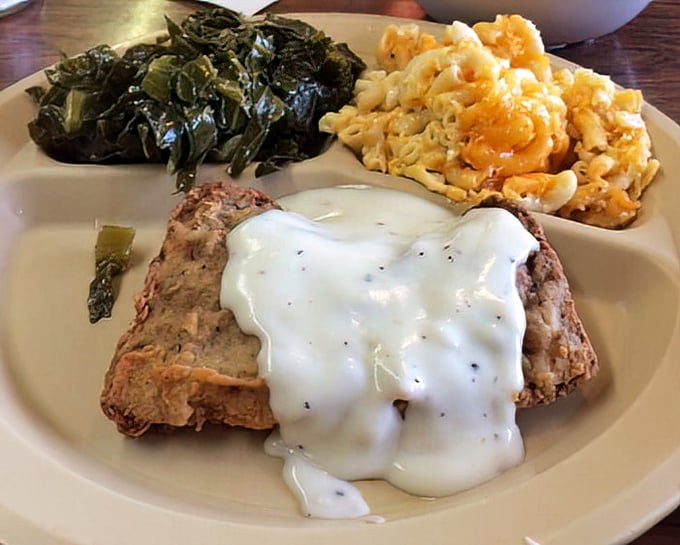 Country fried steak with gravy, collard greens, and mac & cheese—the holy trinity of Southern comfort that makes dieting seem like a terrible life choice.