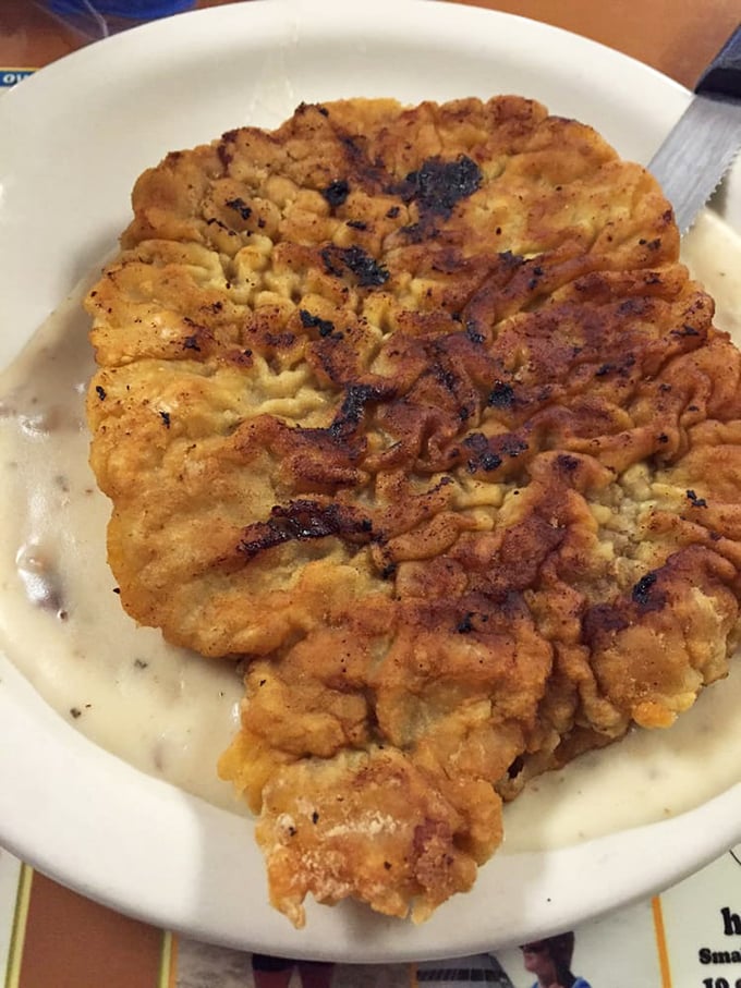This isn't just country fried steak – it's a golden-brown masterpiece that makes you wonder why you'd ever eat anything else.