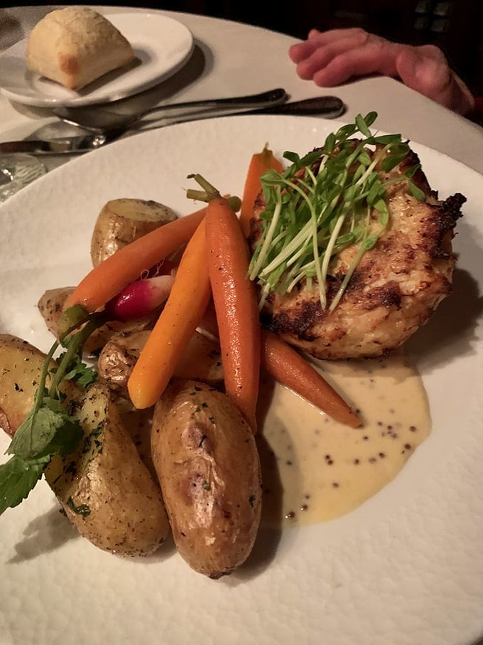 Not just another pretty plate—this perfectly seared protein surrounded by seasonal vegetables proves that Lancaster knows sophistication beyond buggy rides.