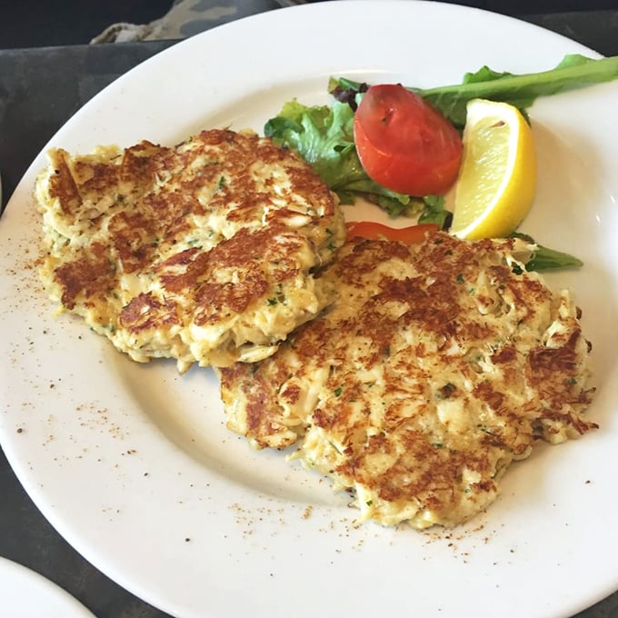 Maryland crab cakes done right—mostly crab, minimal filler, perfectly golden—served with the requisite lemon wedge that's more tradition than necessity at this point.