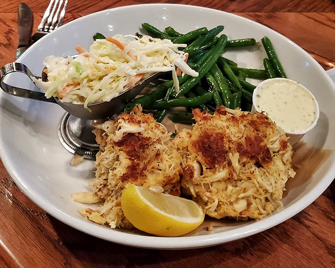These crab cakes are what Maryland dreams about—mostly crab, minimal filler, maximum flavor. Served with green beans that actually taste like vegetables should.