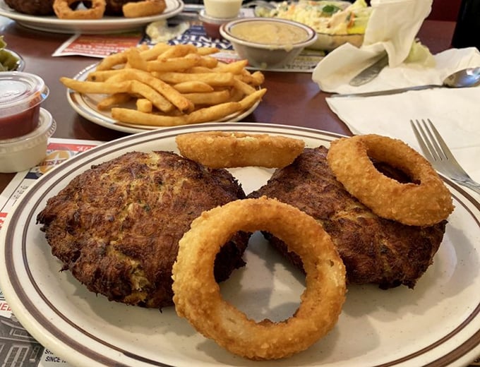 These crab cakes and onion rings aren't just food—they're edible proof that sometimes the simplest pleasures deliver the most satisfaction.