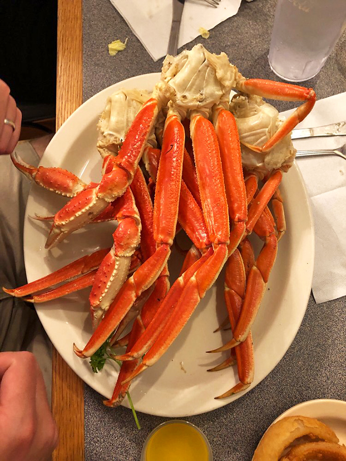 Snow crab legs arranged like nature's perfect finger food. The kind of dish that justifies wearing that plastic bib with absolutely zero embarrassment.