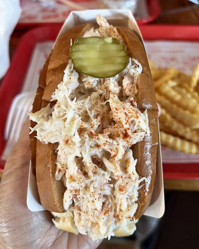 This lobster roll isn't playing games – chunks of sweet meat practically spilling over the sides. Restraint is overrated.
