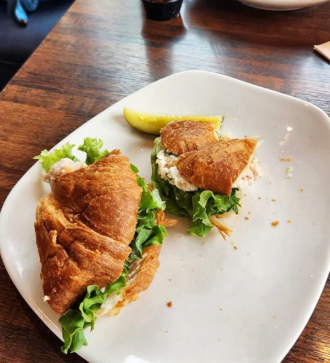 A croissant crab sandwich that makes you question why you ever settled for tuna. The flaky layers practically giggle with delight.
