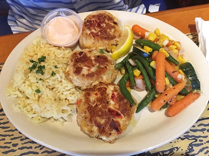 These golden crab cakes aren't just cooked – they're bronzed, seasoned, and ready for their culinary Olympic medal ceremony.