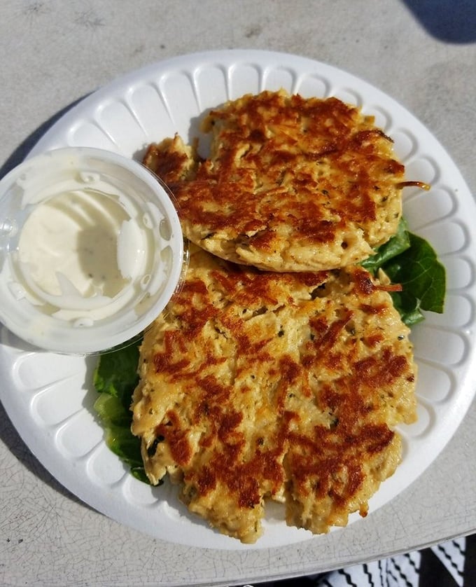 These golden crab cakes aren't just fried—they're a crispy homage to the sea, waiting to shatter delicately against your eager fork.