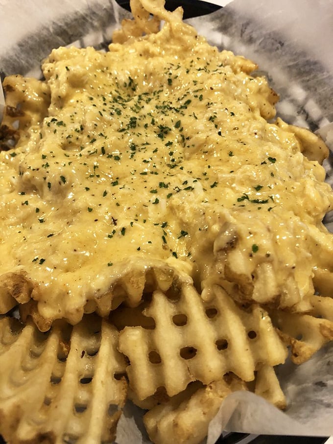Golden crab fries swimming in cheese sauce—proof that sometimes the best battlefield strategy is "death by deliciousness."
