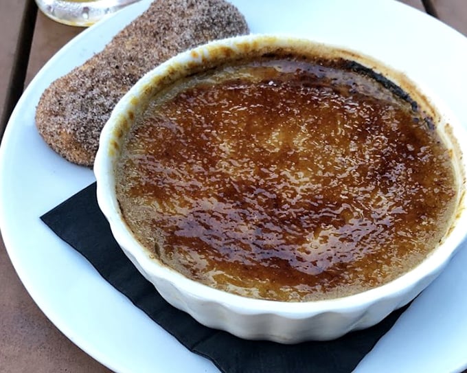 Crack through that glassy caramelized top like you're breaking into Fort Knox—the creamy custard treasure underneath is worth every calorie.