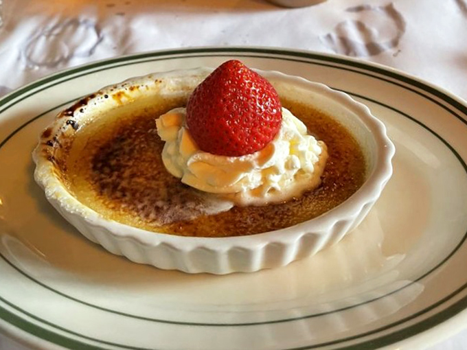 Crème brûlée with that satisfying crack of caramelized sugar—like breaking the ice on a puddle as a kid, but infinitely more delicious.