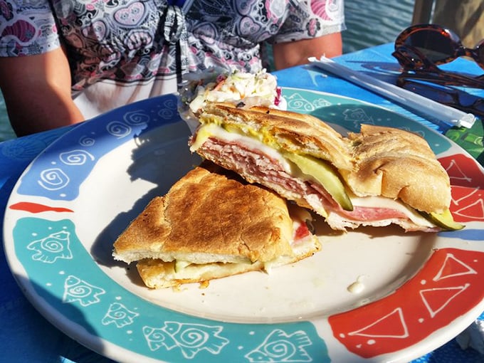 The Cuban sandwich, split open to reveal its secrets—a cross-section of Florida culture pressed between perfectly toasted bread.