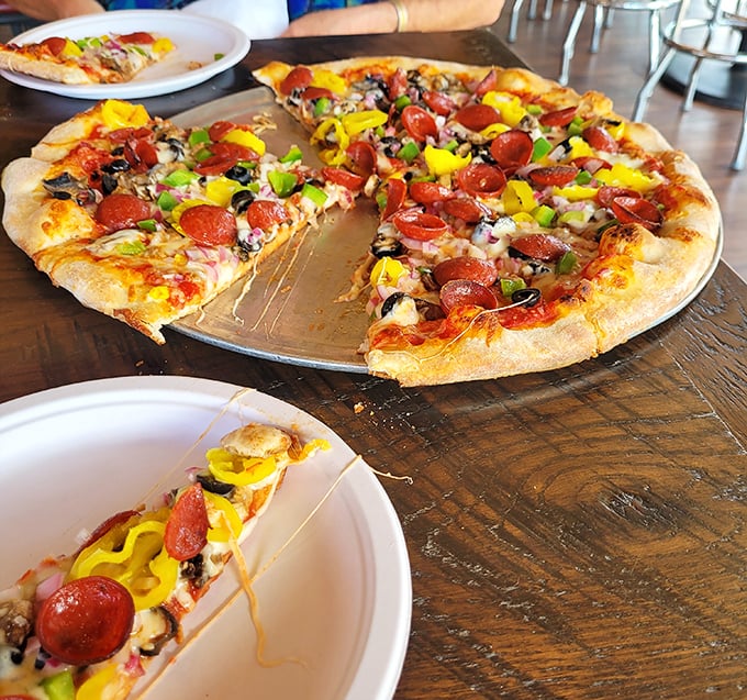 When a pizza looks like this, you don't eat it—you experience it. Those toppings aren't just ingredients; they're a colorful celebration.