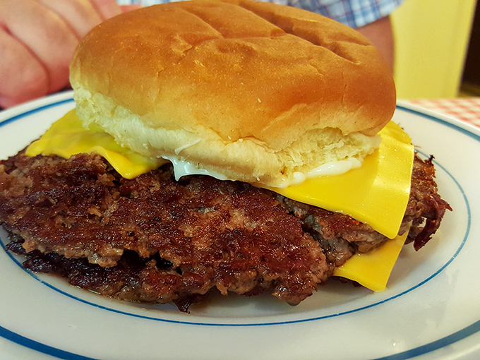 The Double Rod Burger doesn't play games—just a perfectly seasoned patty with American cheese melting into every nook and cranny of caramelized beef.