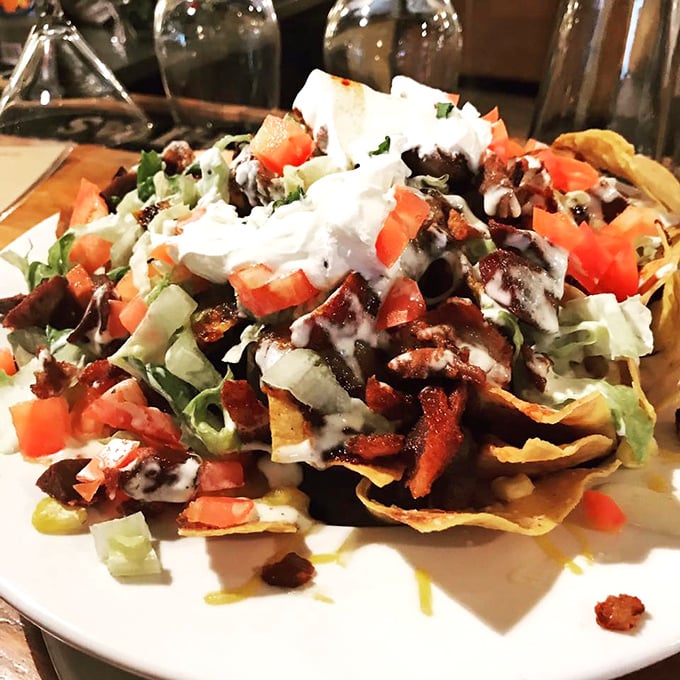 These loaded nachos don't just speak to you—they sing a full opera of flavors with each perfectly constructed bite.