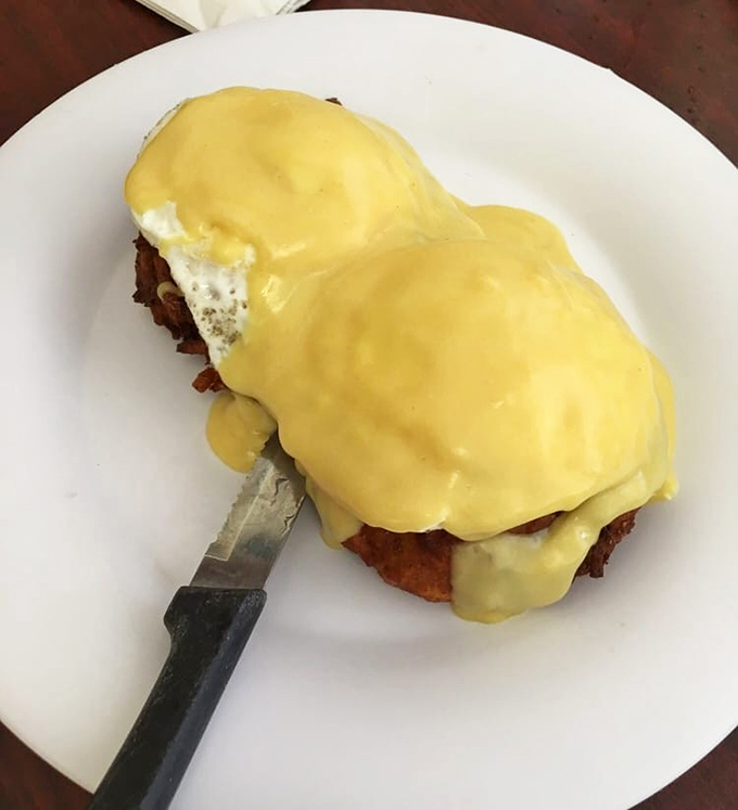 Eggs Benedict that would make a brunch snob weep with joy—golden hollandaise draped over perfectly poached eggs like a silky sunrise.