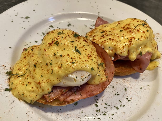 Eggs Benedict gets the Southern treatment here – perfectly poached eggs perched atop ham on English muffins, draped in hollandaise that whispers "take your time."
