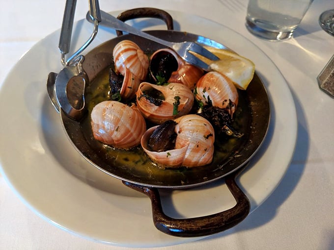 Escargot swimming in buttery goodness – proof that sometimes the most delicious things come in the most humble packages.