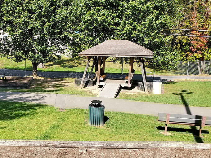 This humble park pavilion has witnessed countless family reunions, first kisses, and impromptu picnics – the silent keeper of small-town memories.