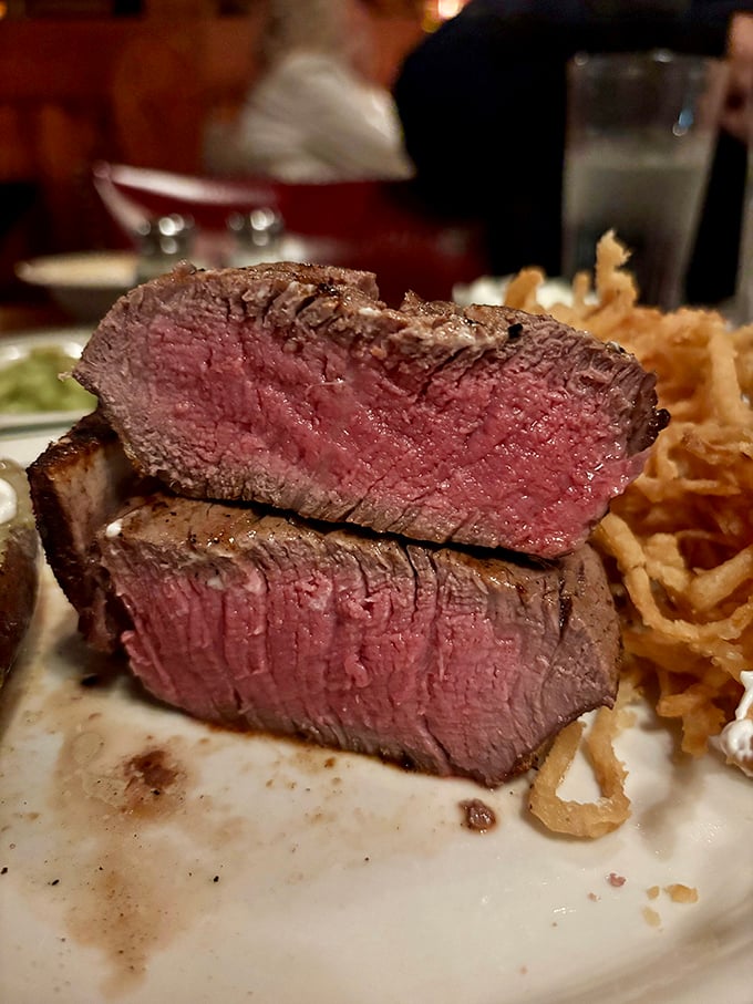 A perfectly cooked filet mignon reveals its blushing interior – the steak equivalent of catching Sophia Loren in her prime.