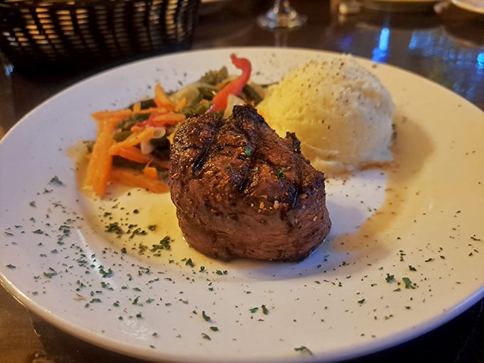 This filet mignon doesn't need to shout for attention—it commands it with quiet confidence and a side of perfectly cooked vegetables.