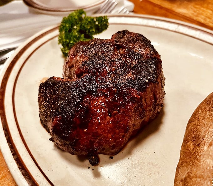 This filet mignon isn't just a steak; it's a meditation on perfection—a crusty exterior giving way to a center so tender it practically dissolves on contact.
