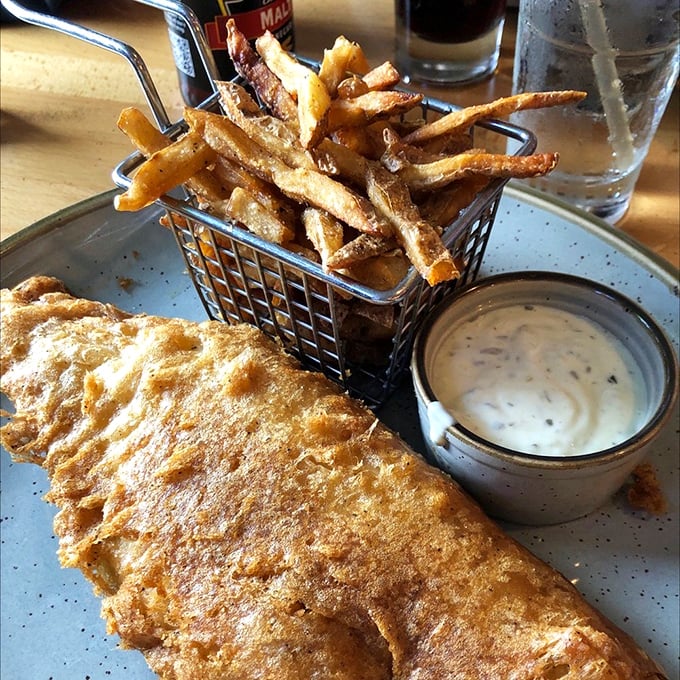 Crispy on the outside, tender within—this fish and chips basket comes with a side of nostalgia and a dipping sauce worth double-dipping for.