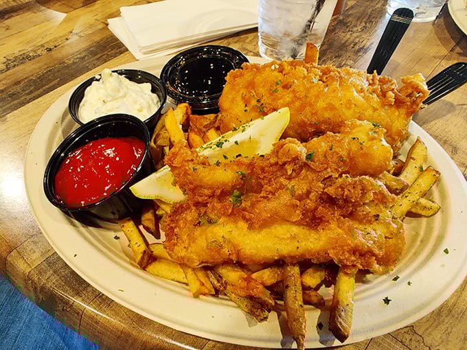 Golden-battered fish and chips with three dipping sauces—because sometimes decisions are hard and deliciousness shouldn't be limited to just one condiment.