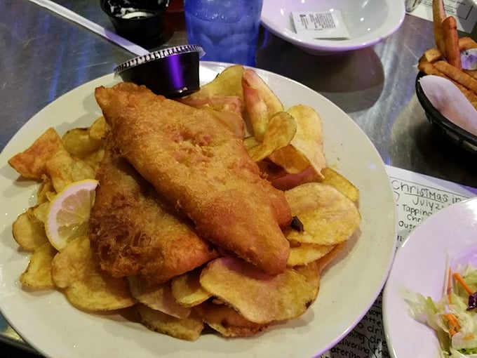 Fish and chips that would make the British jealous – golden-battered fish atop a mountain of homemade potato chips. The lemon wedge adds a touch of class.