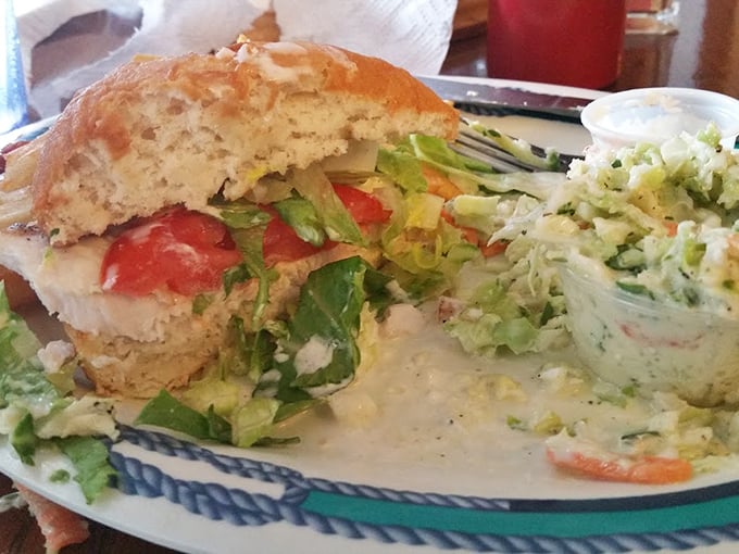 Fresh catch nestled in a bun with all the fixings – sometimes the simplest presentations deliver the most memorable flavors.