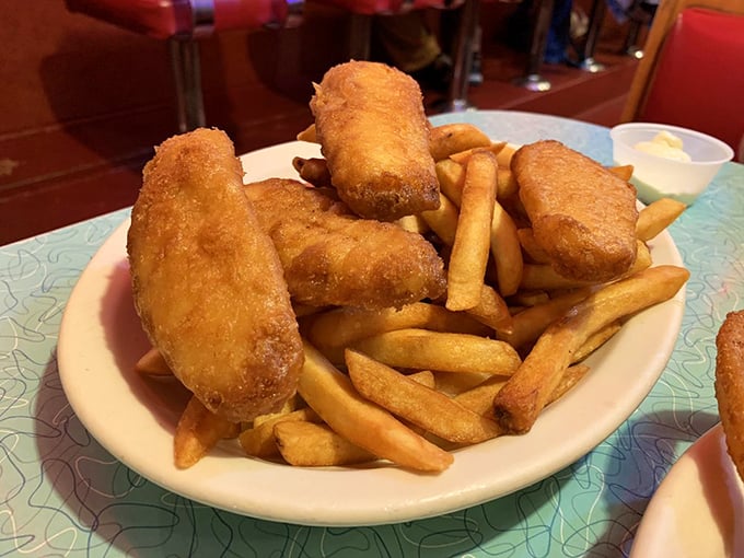 Golden-battered fish and crispy fries—the kind of comfort food that makes you forget you're supposed to be counting calories on vacation.