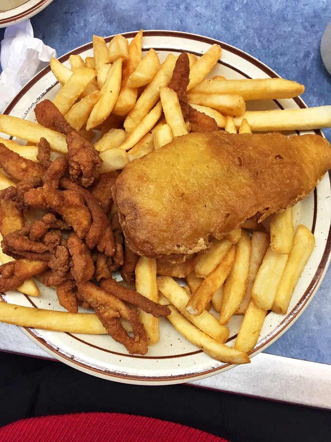 Golden-brown fish and crispy fries huddle together on a classic diner plate—comfort food that's been perfecting its act for over eight decades.