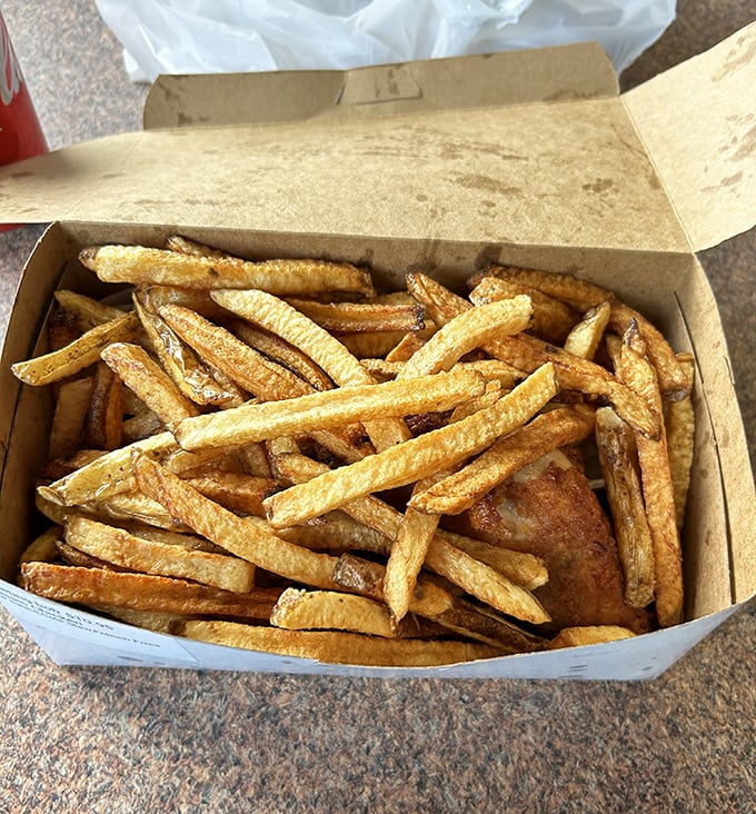 These fries aren't sidekicks – they're co-stars, golden and crisp, demanding equal billing with their feathered counterpart.
