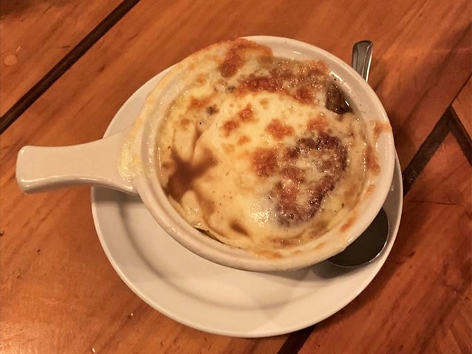 French onion soup topped with bubbling cheese – comfort food that warms both belly and soul on desert nights.